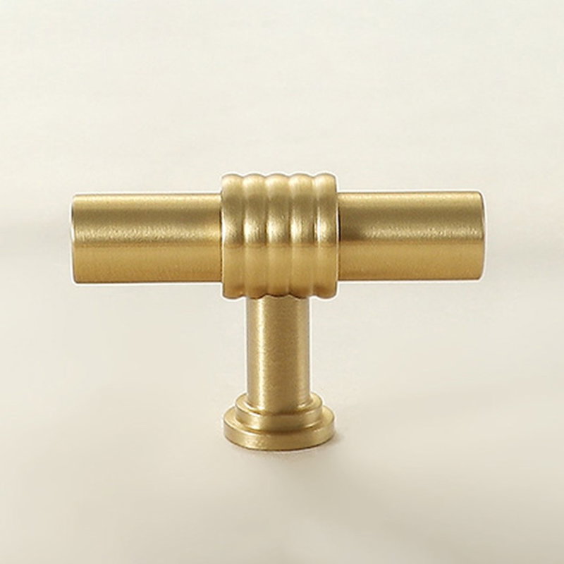 → Elegant Guld T Greb med Snoninger i Kobber | Gratis Fragt